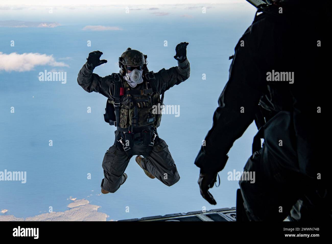 An East-Coast based U.S. Naval Special Warfare Operator (SEAL) jumps ...