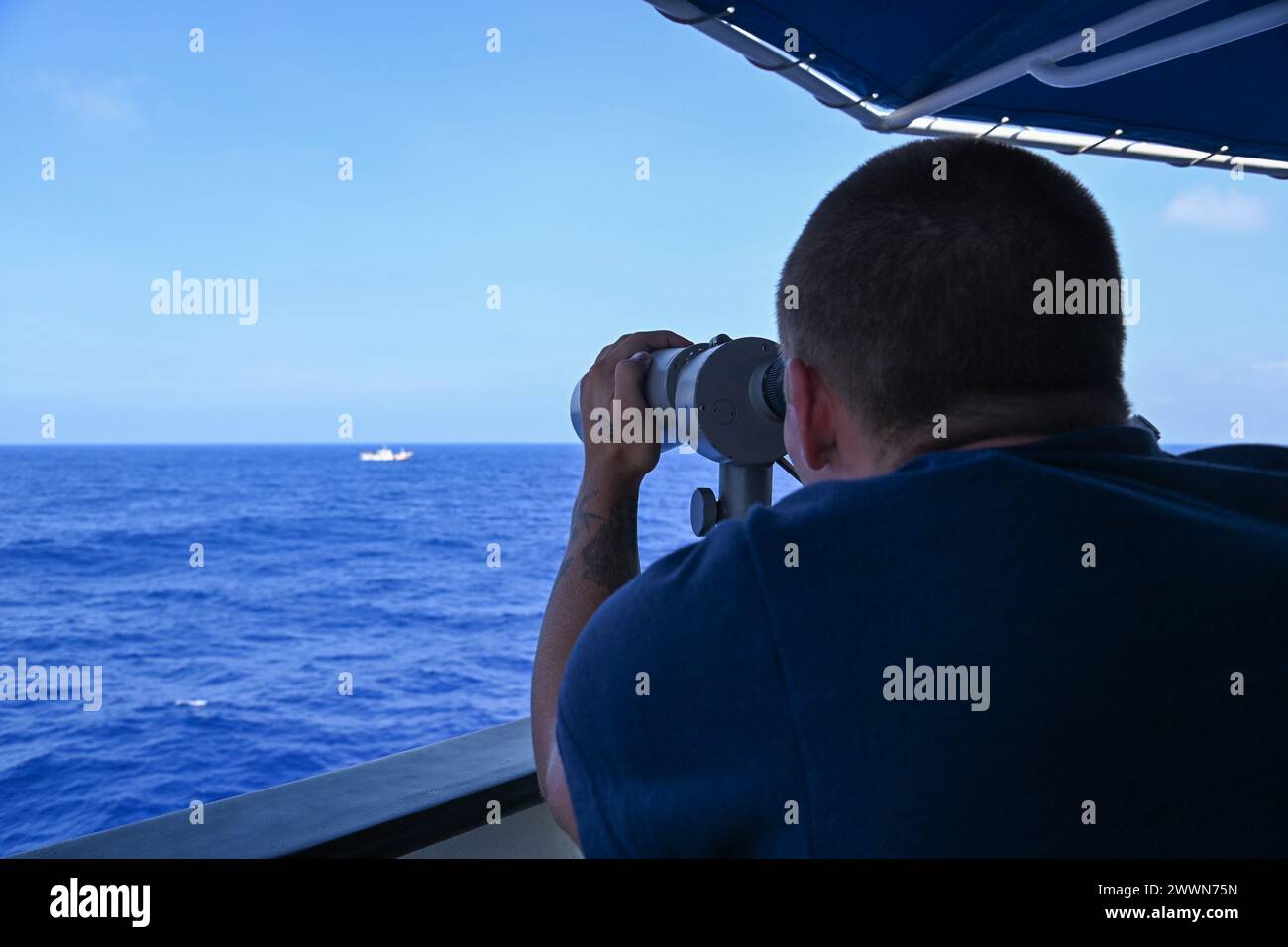 U.S. Coast Guard Petty Officer 2nd Class Dylan Rourke, a U.S. Coast ...
