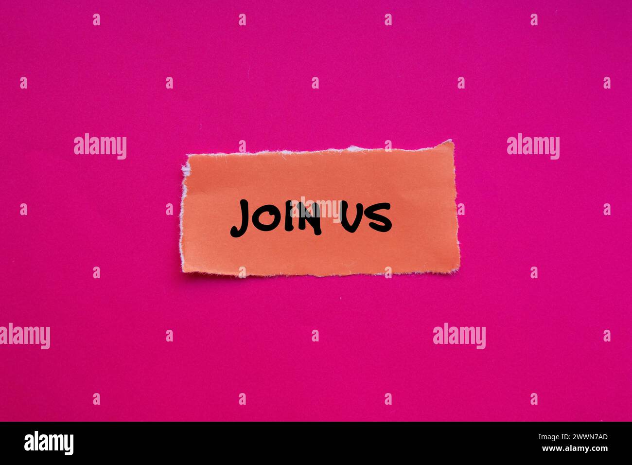 Join us words written on torn paper piece with pink background ...