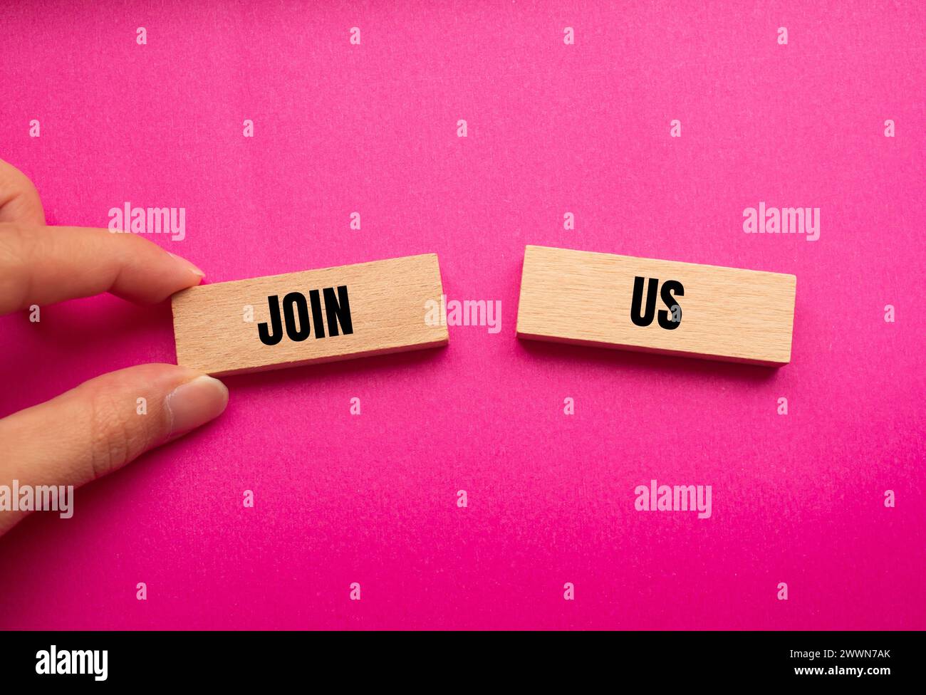 Join us words written on wooden blocks with pink background. Conceptual ...