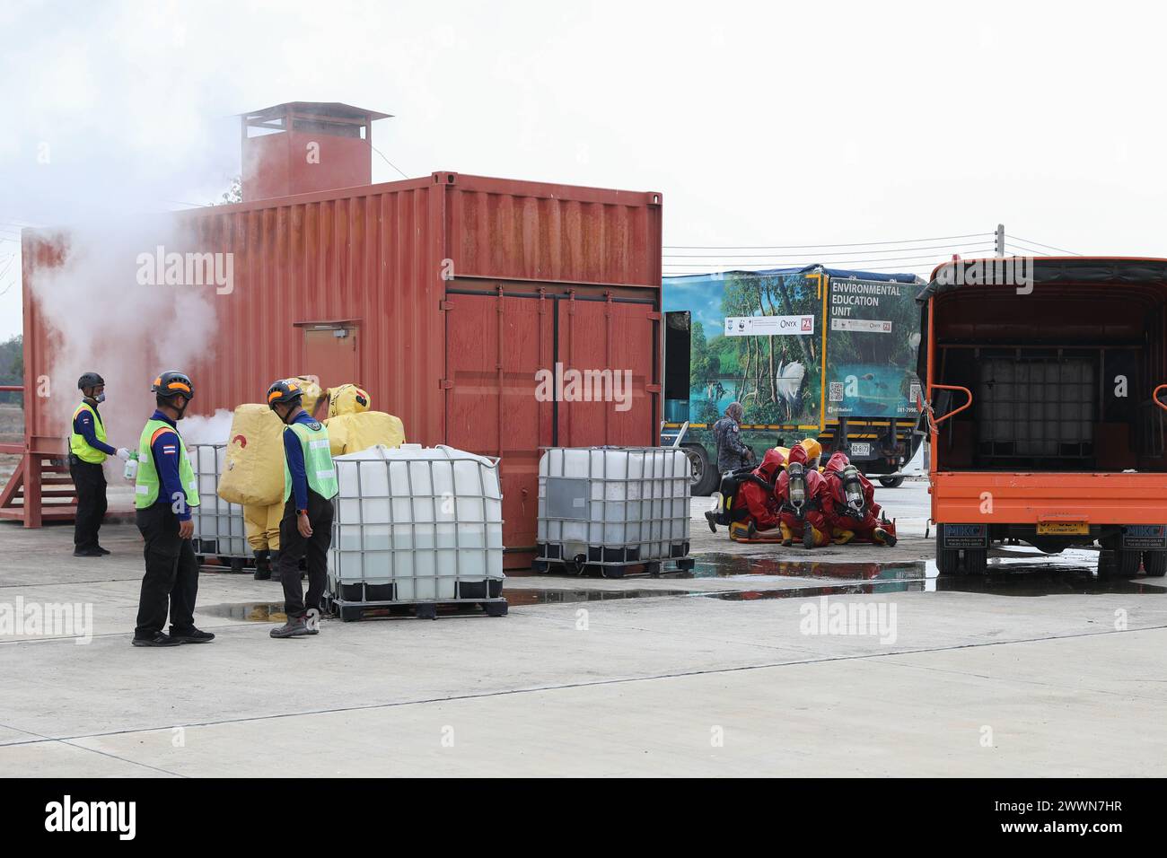 A decontamination team with the Thai Joint Training Academy Center ...