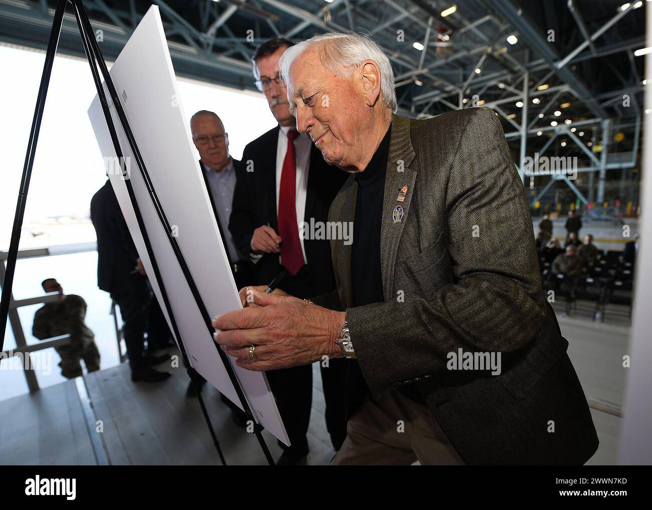 Ralston Mayor Don Grosser signs a board during a community partnership ...