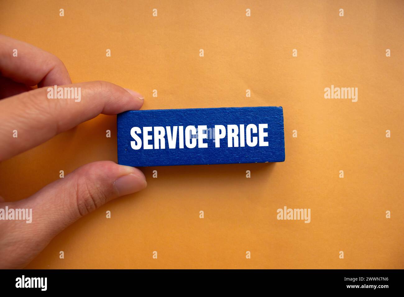 Service price words written on wooden block with orange background ...