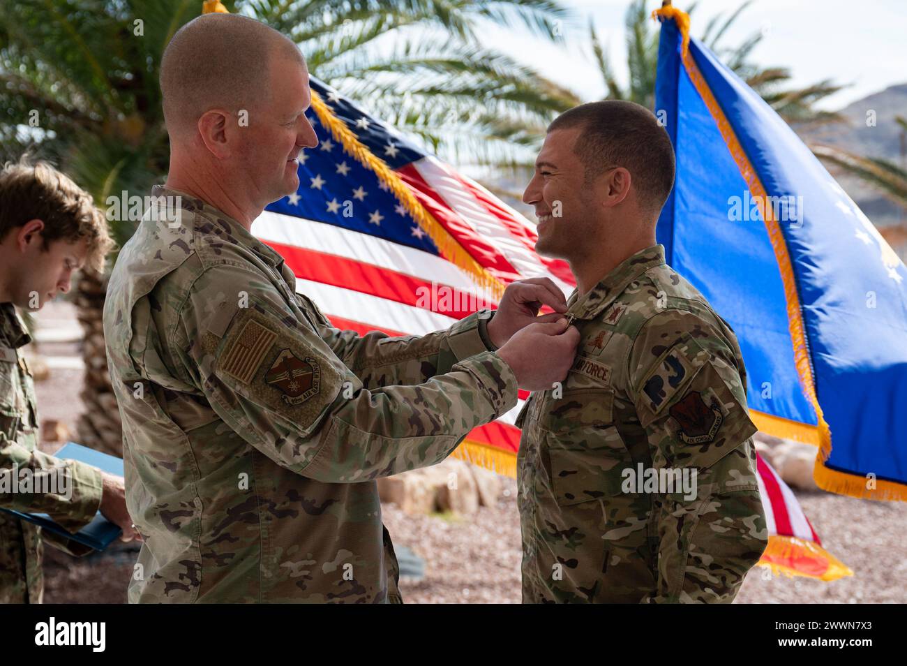 U.S. Air Force Col. Joshua DeMotts, left, 99th Air Base Wing commander ...