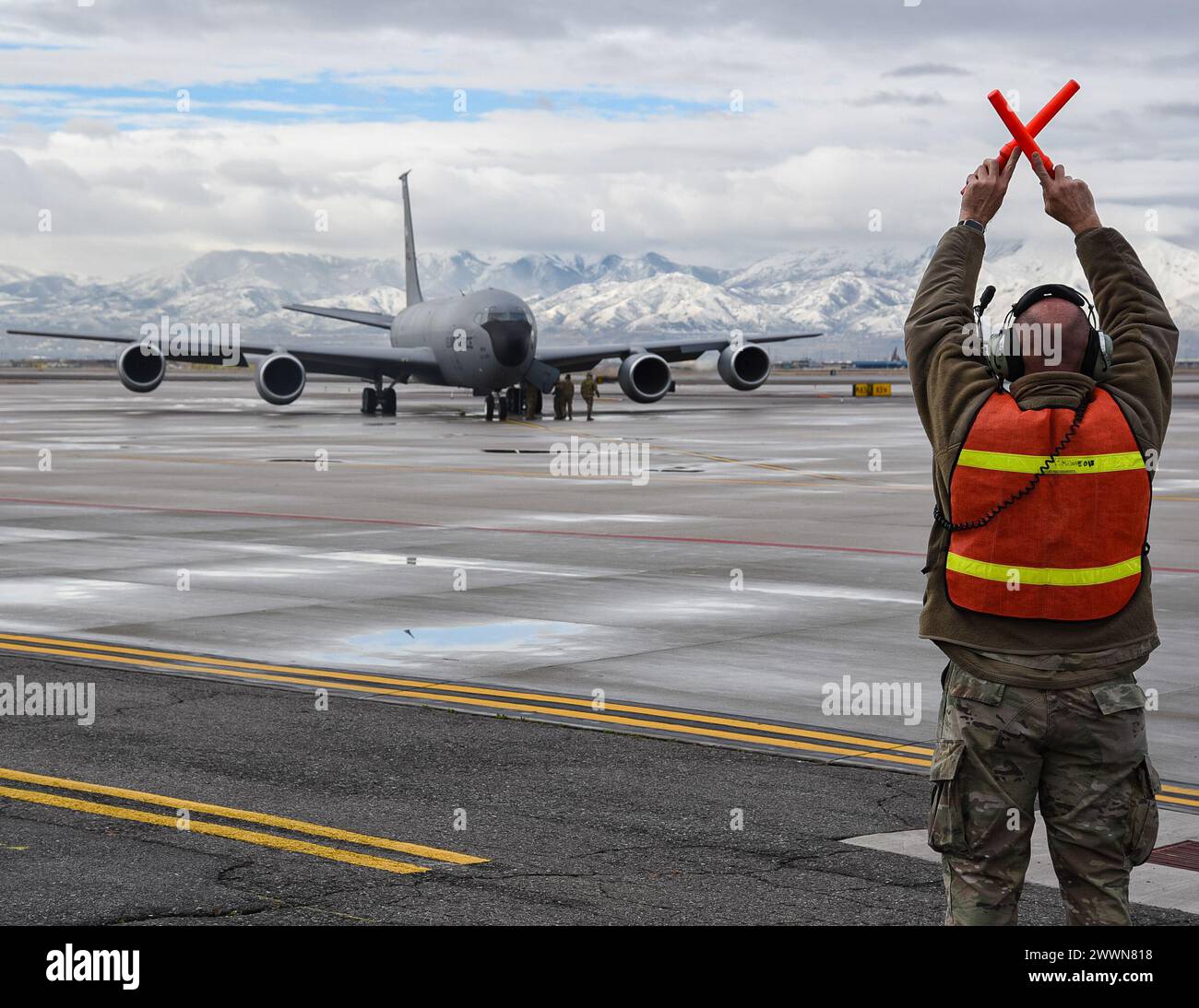 An airman assigned to the 151st Wing, Utah Air National Guard, marshals ...