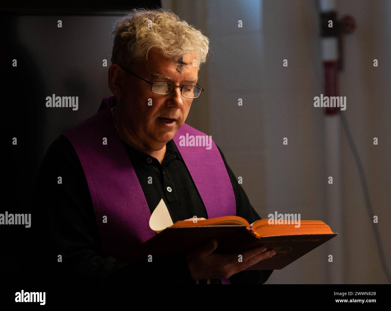 Major Jesus Navarrete, deputy wing chaplain, reads from the Roman ...