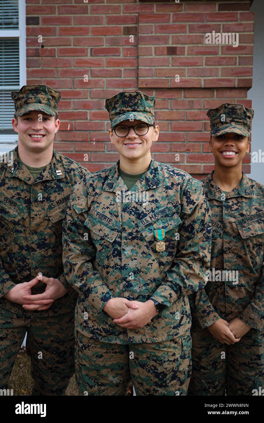 From left to right, U.S. Marine Corps Capt. David Coker, a judge ...