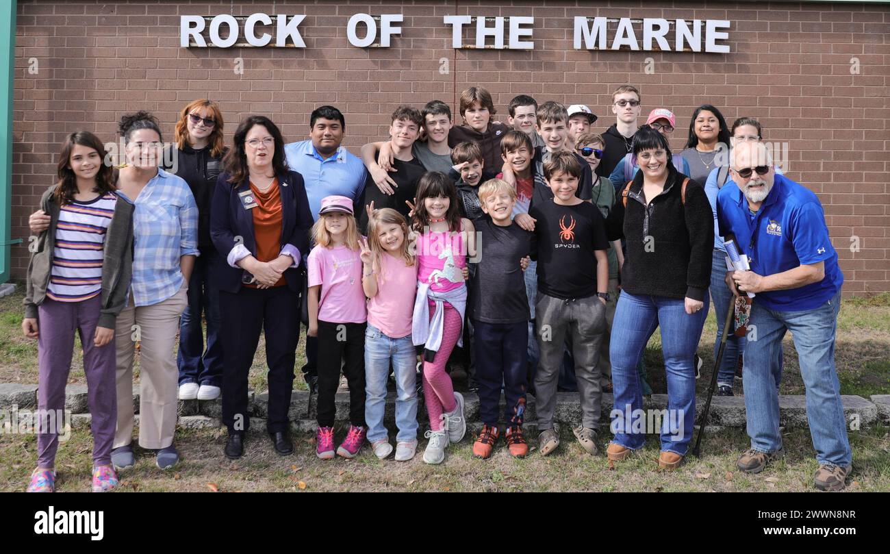 Civilians with a Come Meet Your Army tour group gather for a photo at ...
