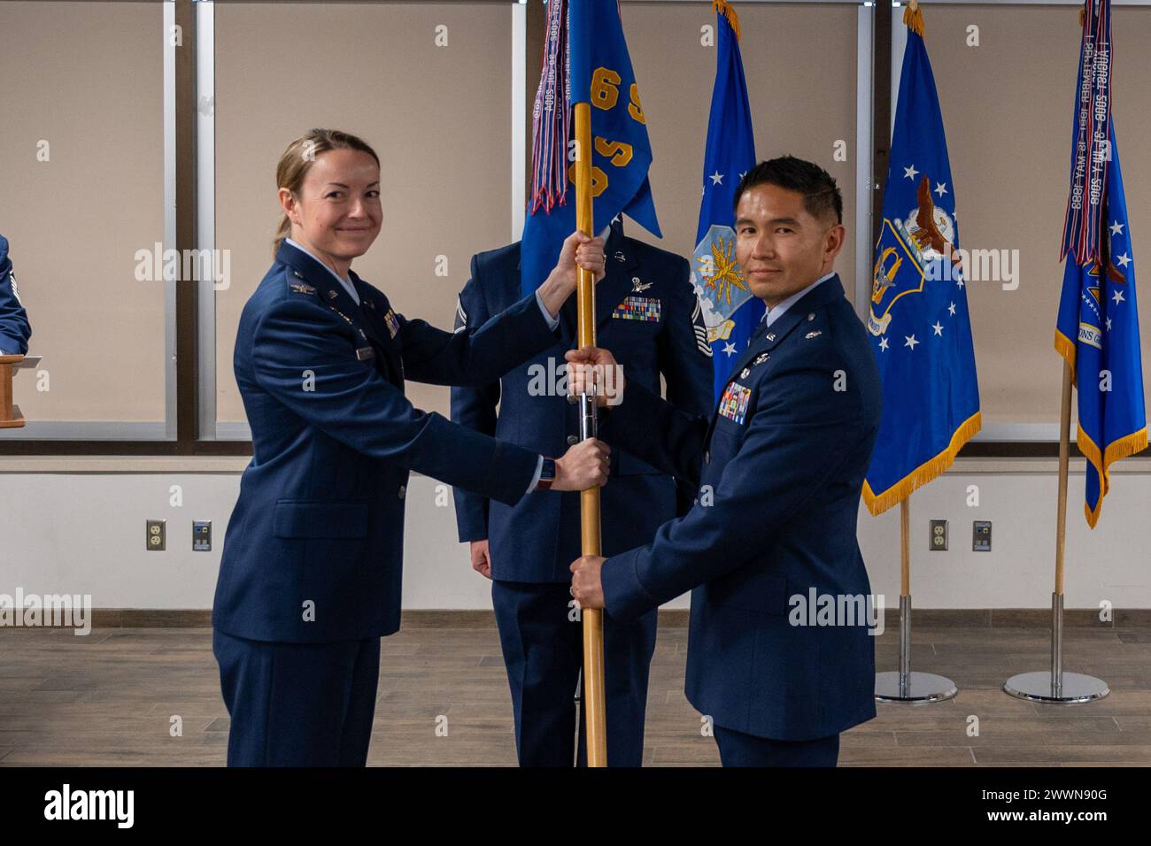 Col. Elizabeth Paget, 310th Operations Group commander, passes the 6th ...