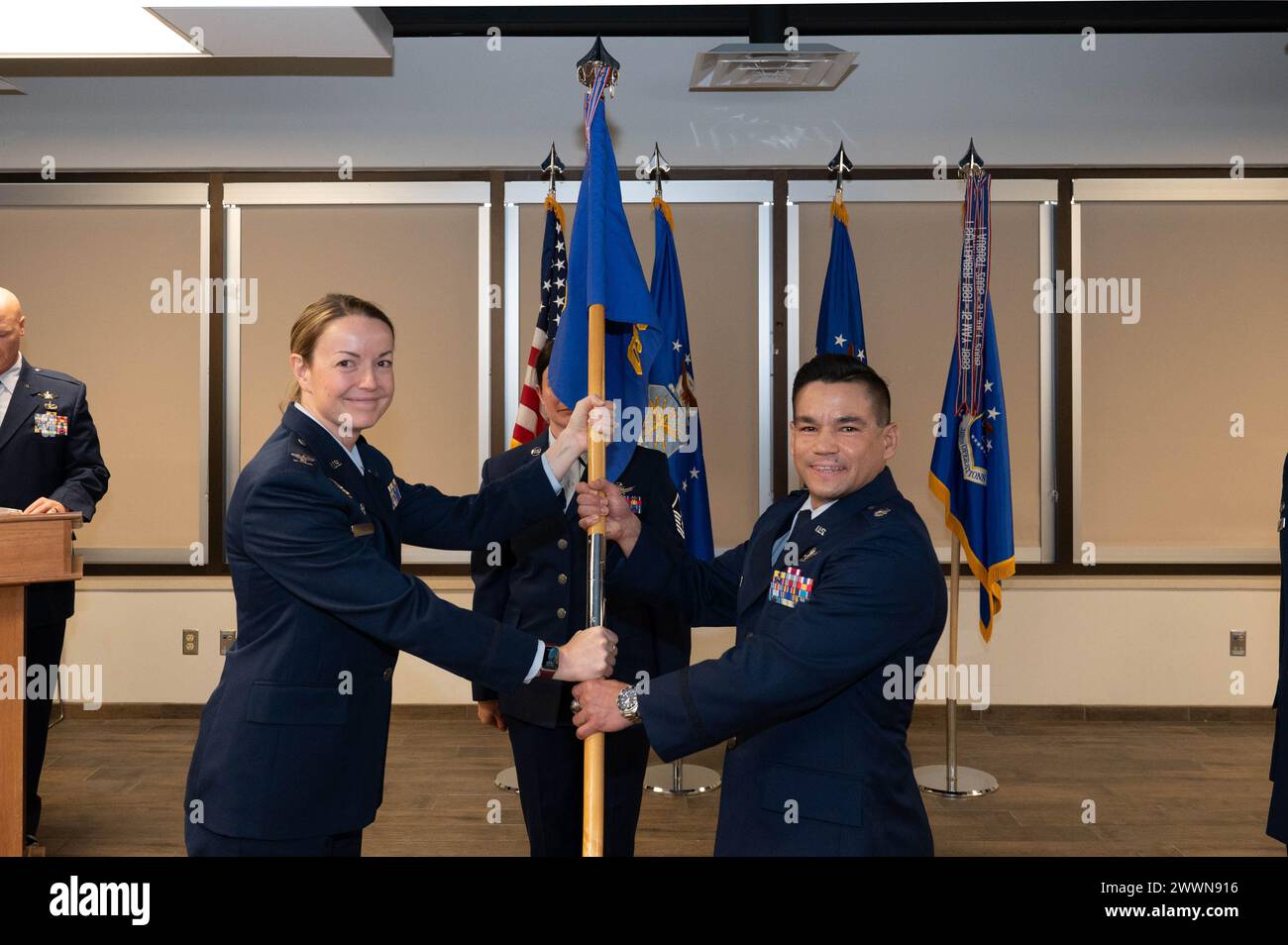 Col. Elizabeth Paget, 310th Operations Group commander, passes the ...