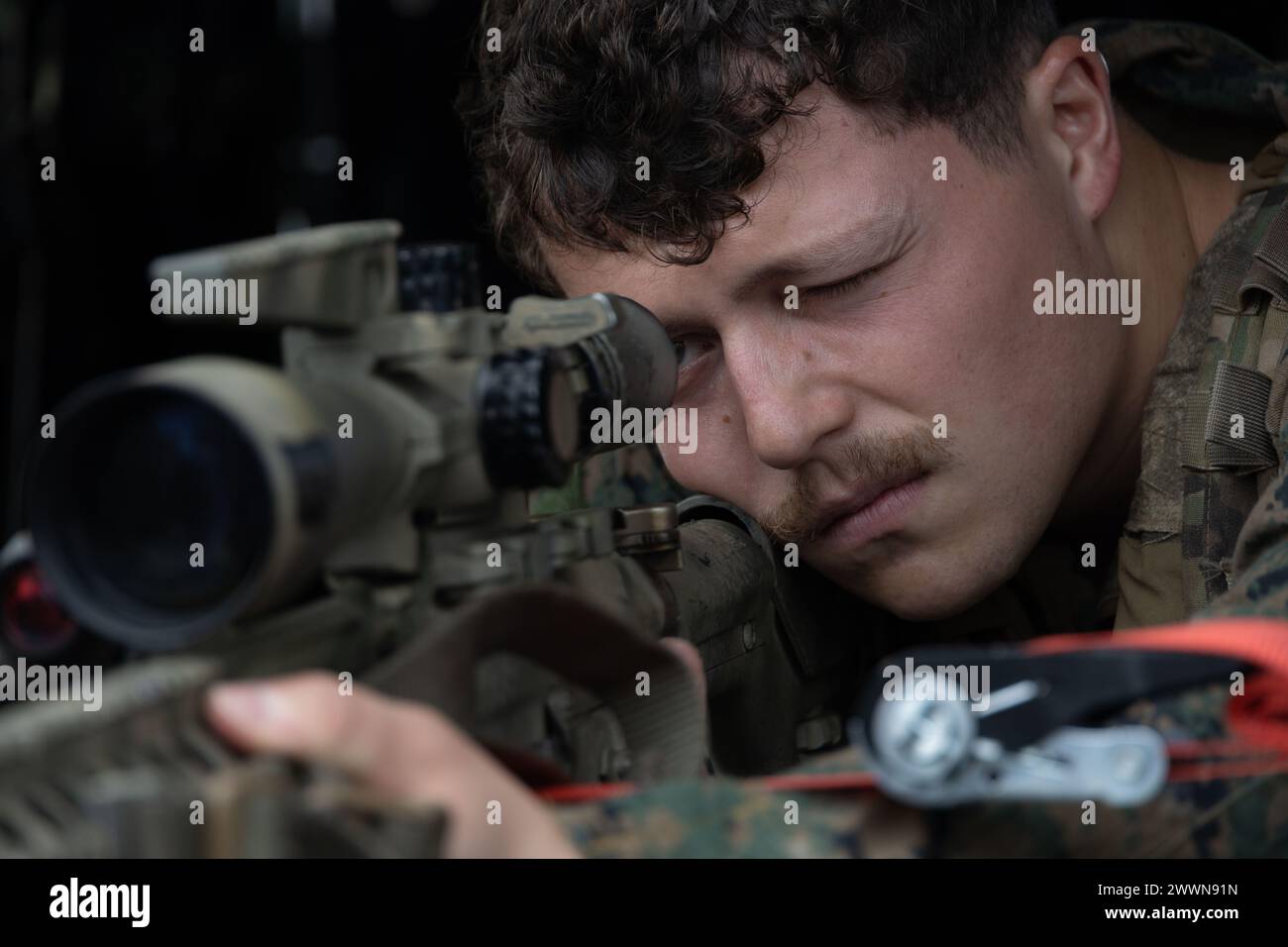 U.S. Marine Corps Sgt. Alec Hunter, a scout sniper with Battalion Landing Team 1/1, 31st Marine ...