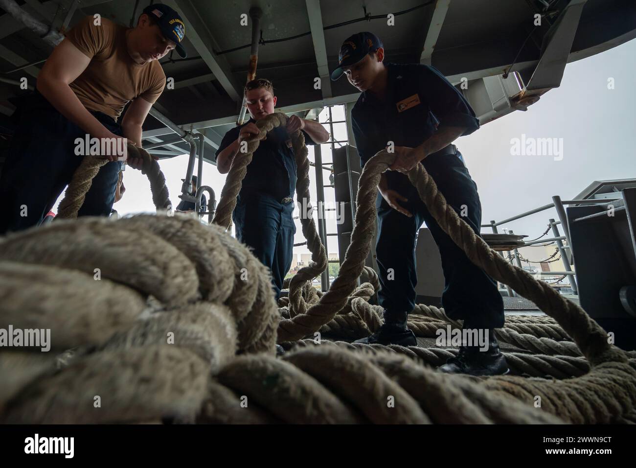 240205-N-FK754-1041 PACIFIC OCEAN (Feb. 5, 2024) Sailors detangle lines ...