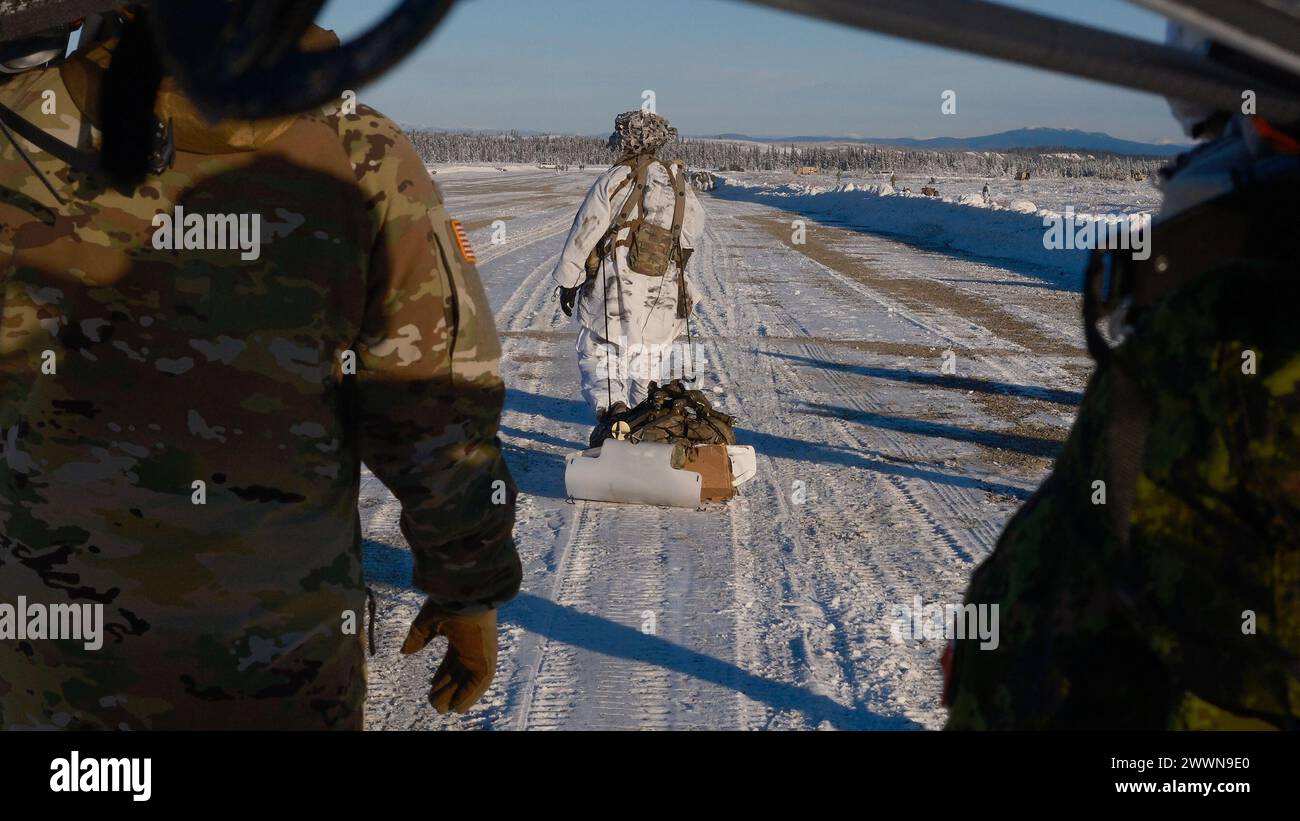 A U.S. Army paratrooper from the 11th Airborne Division leaves Donnelly ...