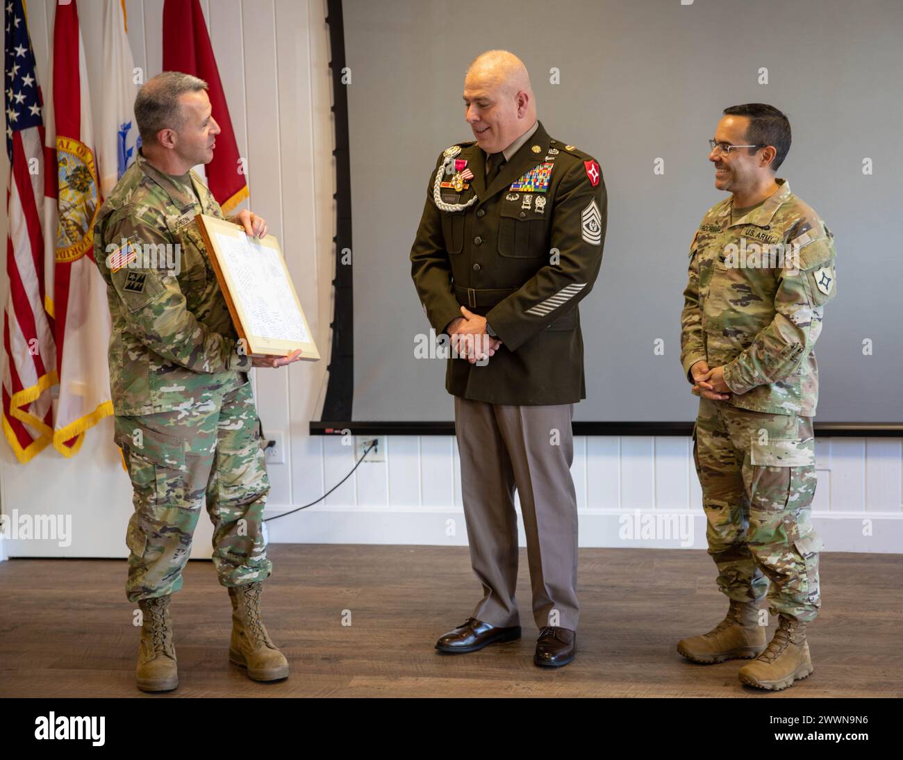 The Florida National Guard (FLNG) Chief of Staff, Col. Felix A. Rodriguez, and the prior Chief ...