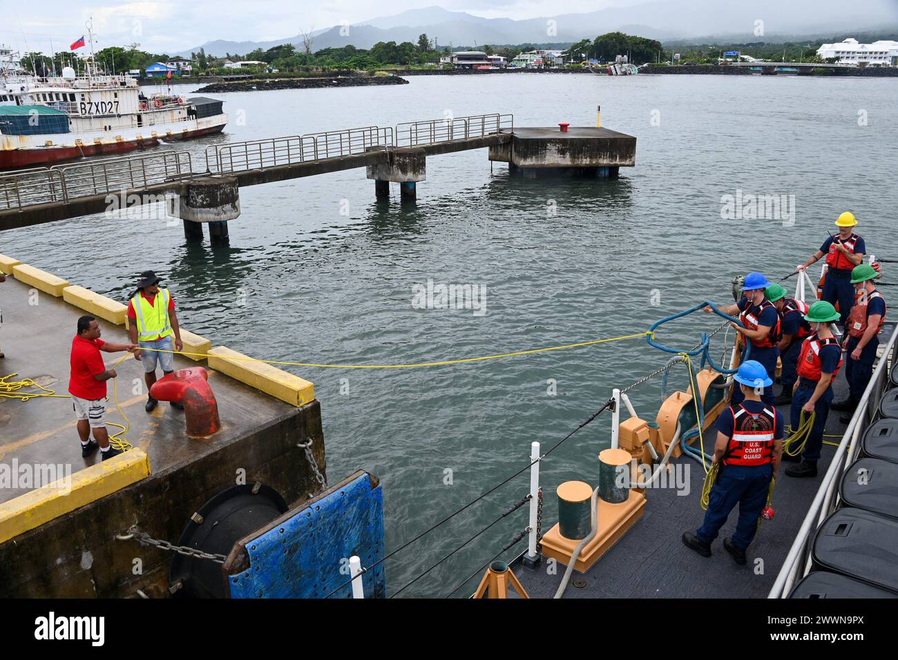 U.S. Coast Guard Cutter Harriet Lane (WMEC 903) crew prepare to moor in ...
