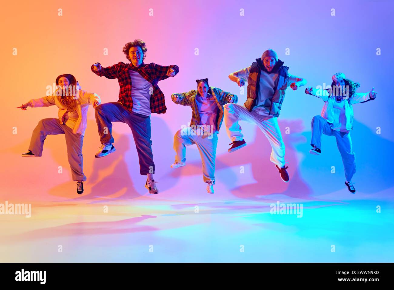 Dynamic poses in dancing. Young people, friends performing hip hop ...