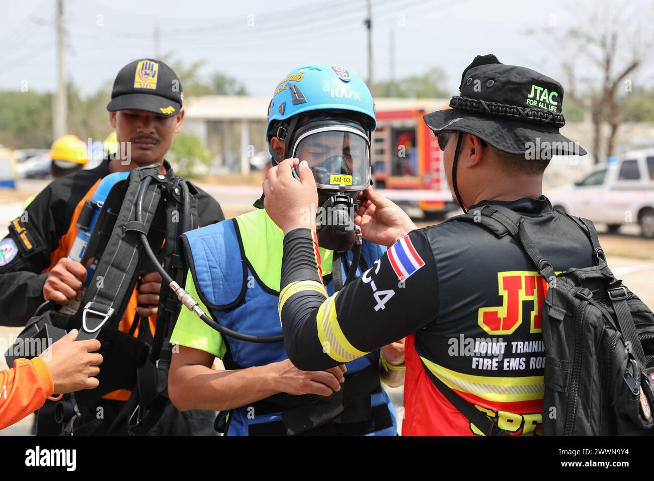 A decontamination team with the Thai Joint Training Academy Center ...