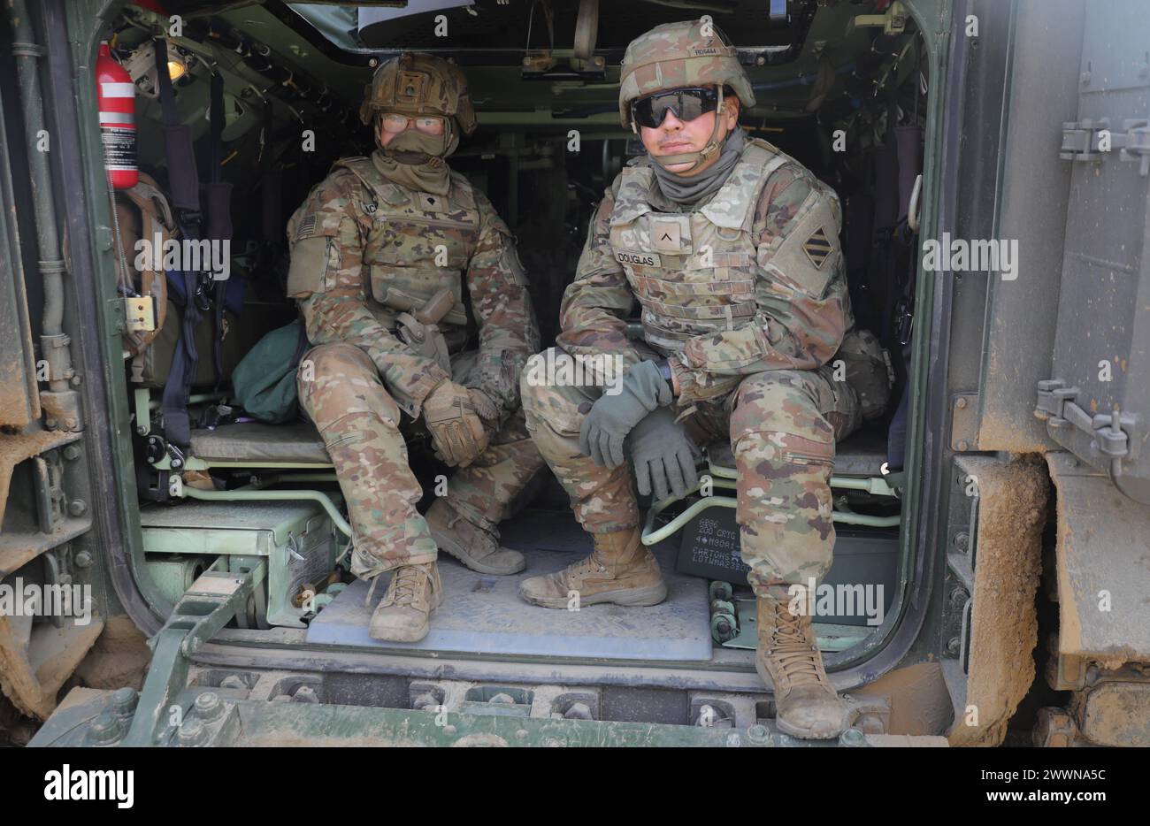U.S. Army Spc. Ethan Acreman, left, and Pvt. Robert Douglas, both ...