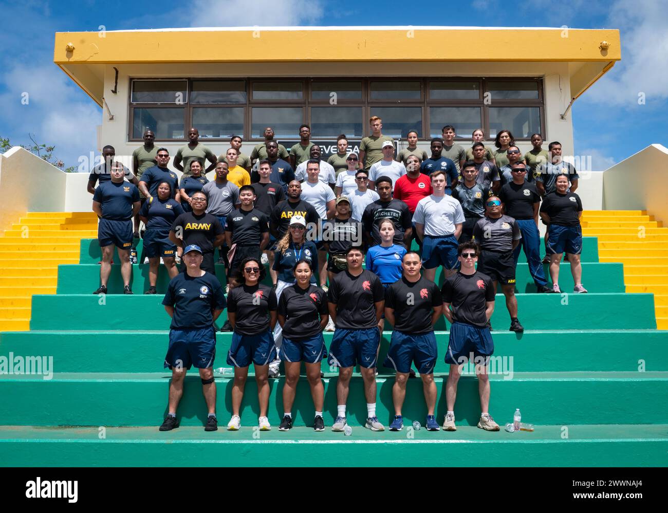 U.S. Air Force, Army, Marine Corps and Navy service members pose with ...