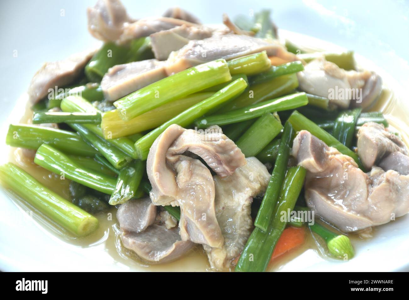 stir fried garlic chives with chicken organ on plate Stock Photo - Alamy