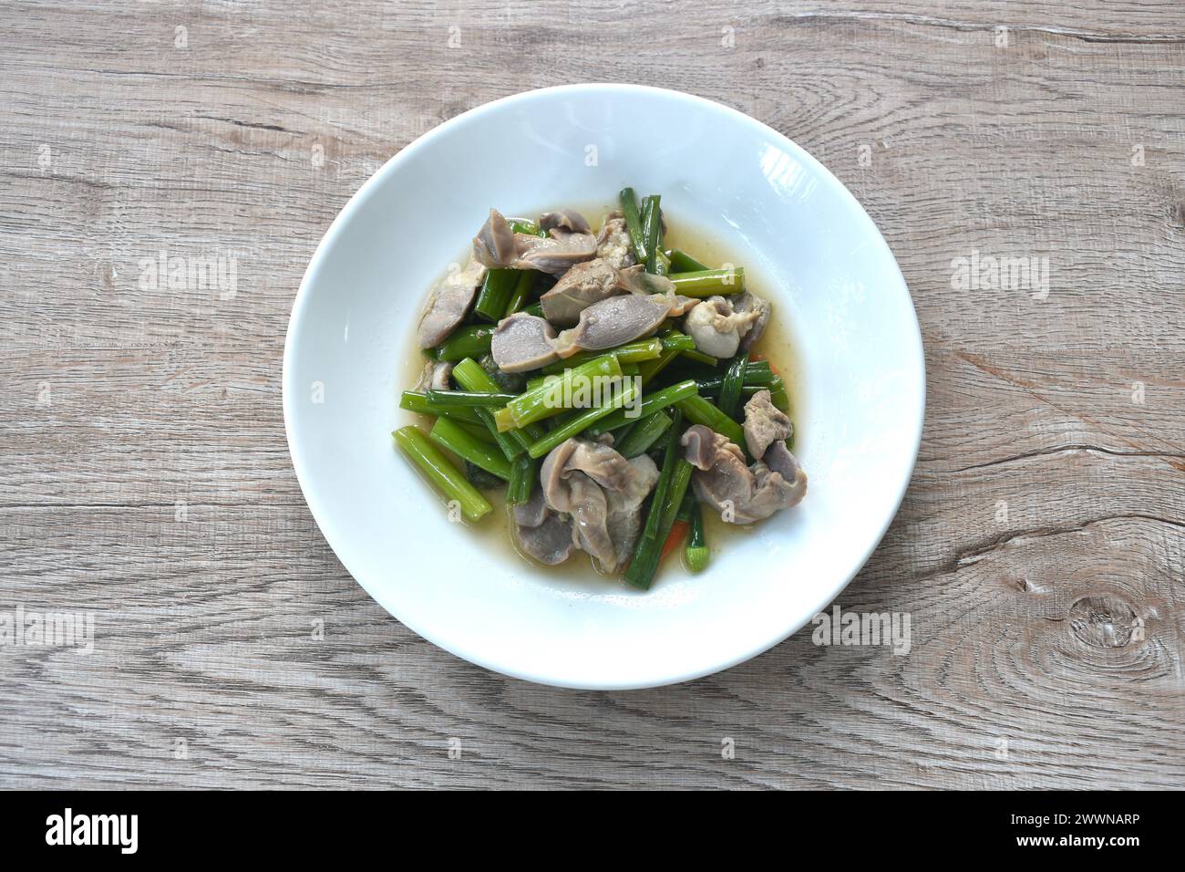 stir fried garlic chives with chicken organ on plate Stock Photo - Alamy