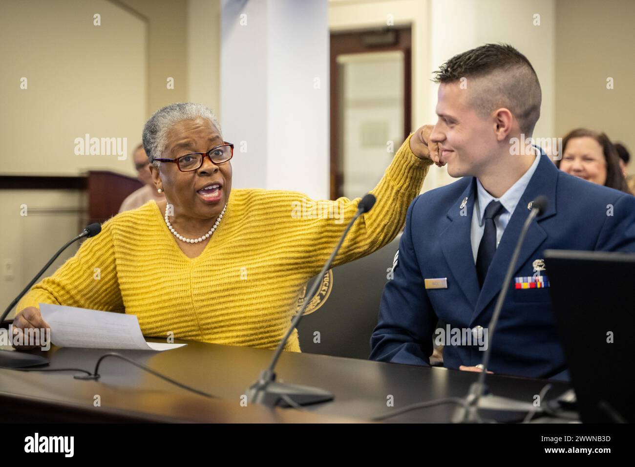 Retired Air Force colonel and State Rep. Pamela Stevenson, left, reads ...