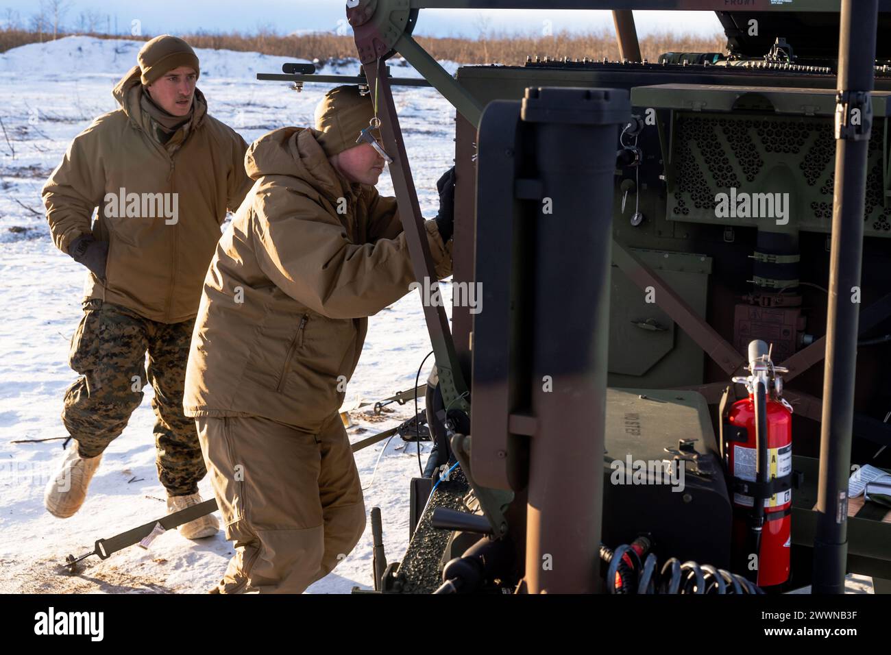 U.S. Marine Corps Cpl. Toby Callaway (left), a radar technician with ...