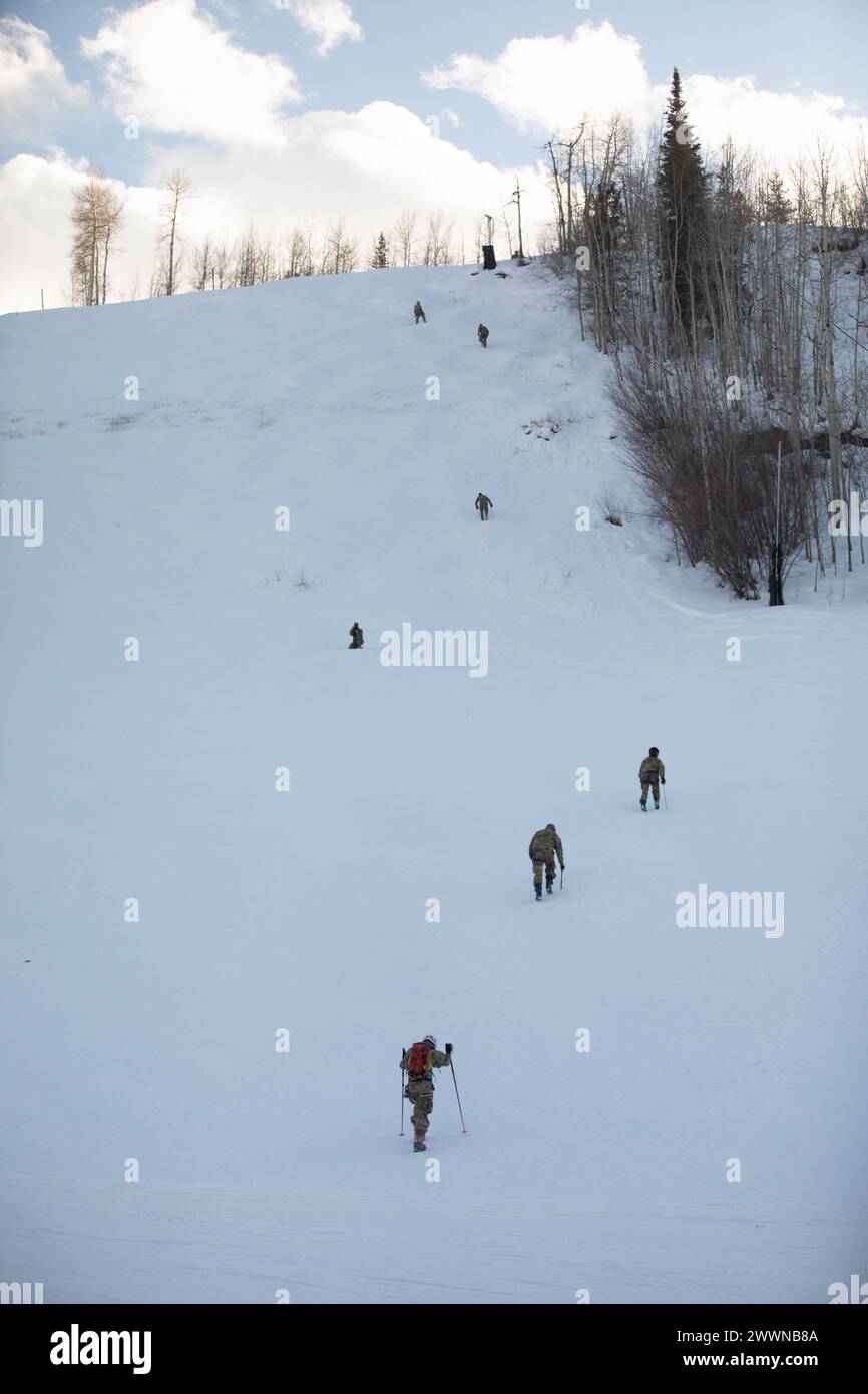 Soldiers with the 10th Mountain Division climb a slope during the ...