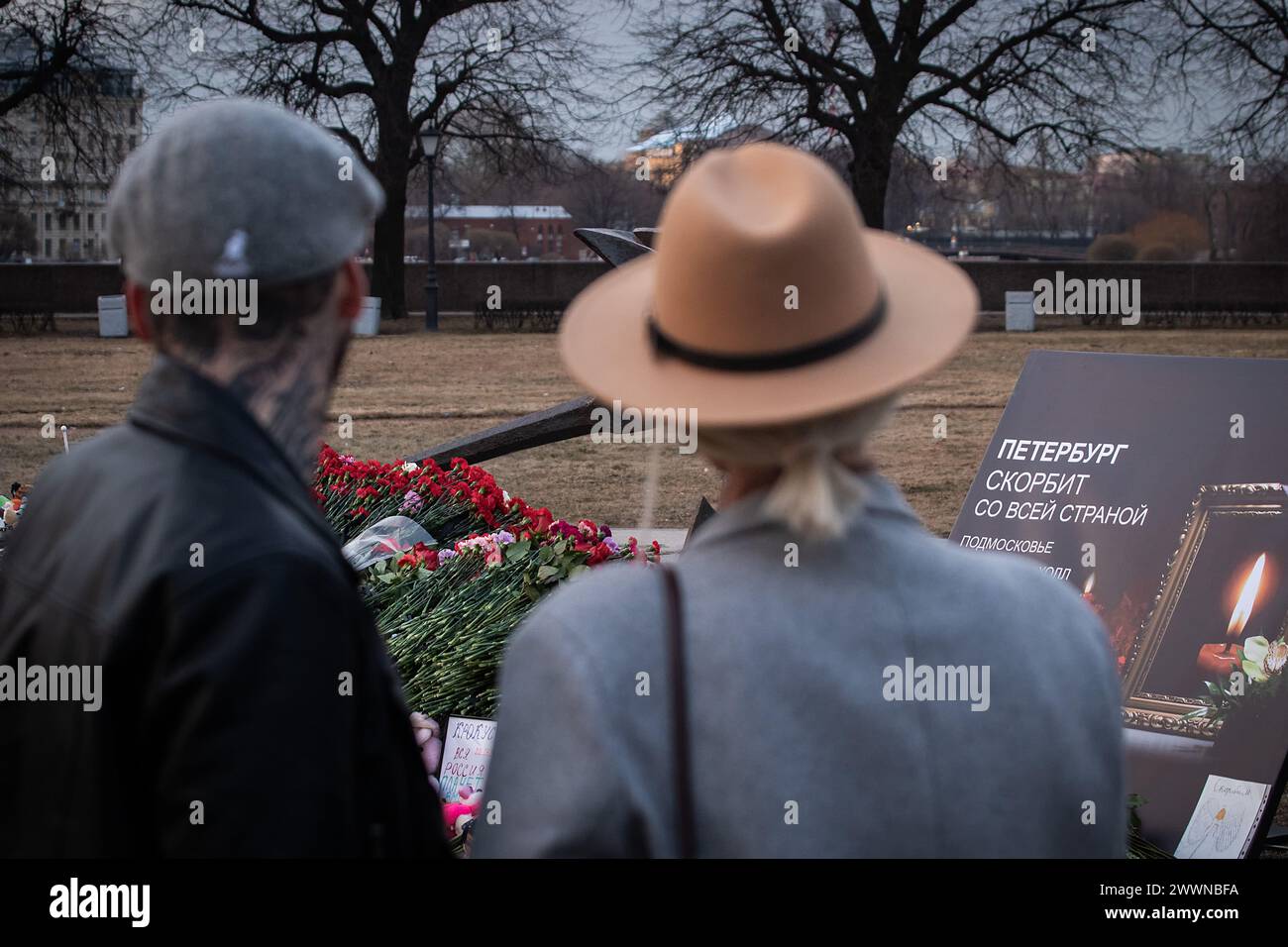 People mourn at a spontaneous memorial to the victims of the terrorist ...