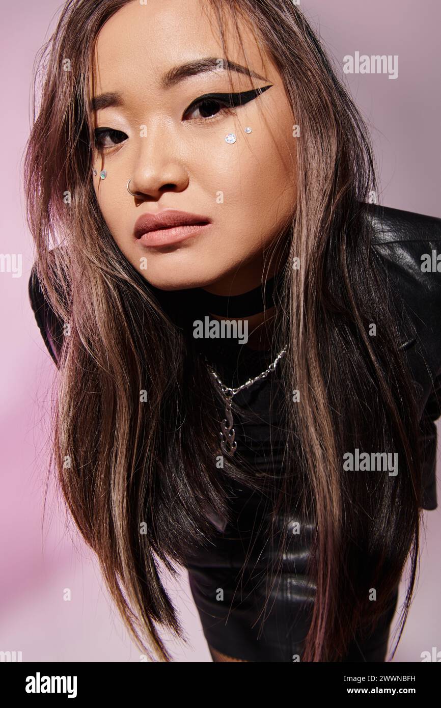close up of lovely asian girl with heavy makeup leaning forward against ...