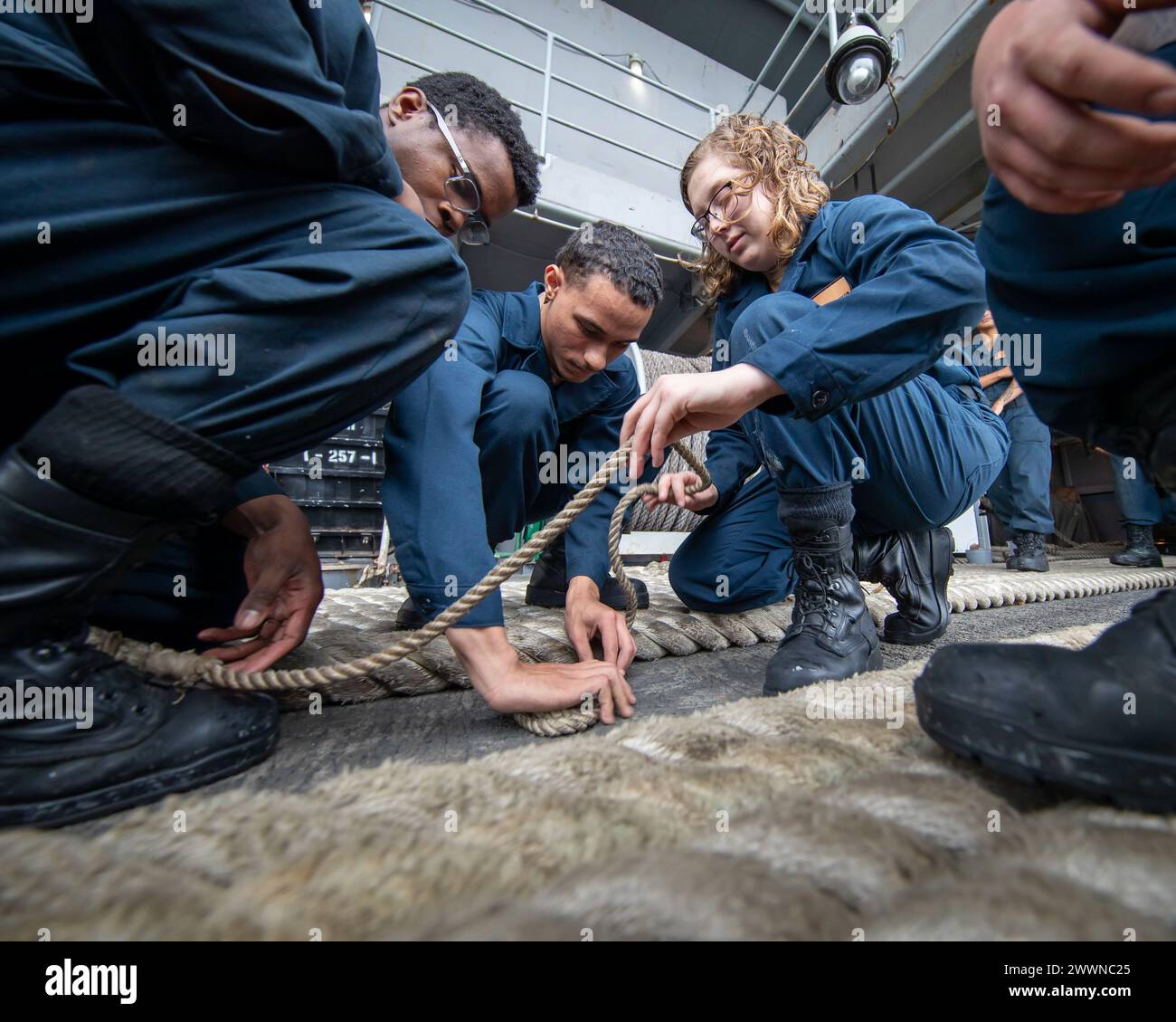 240205-N-FK754-1058 PACIFIC OCEAN (Feb. 5, 2024) Sailors fake down ...