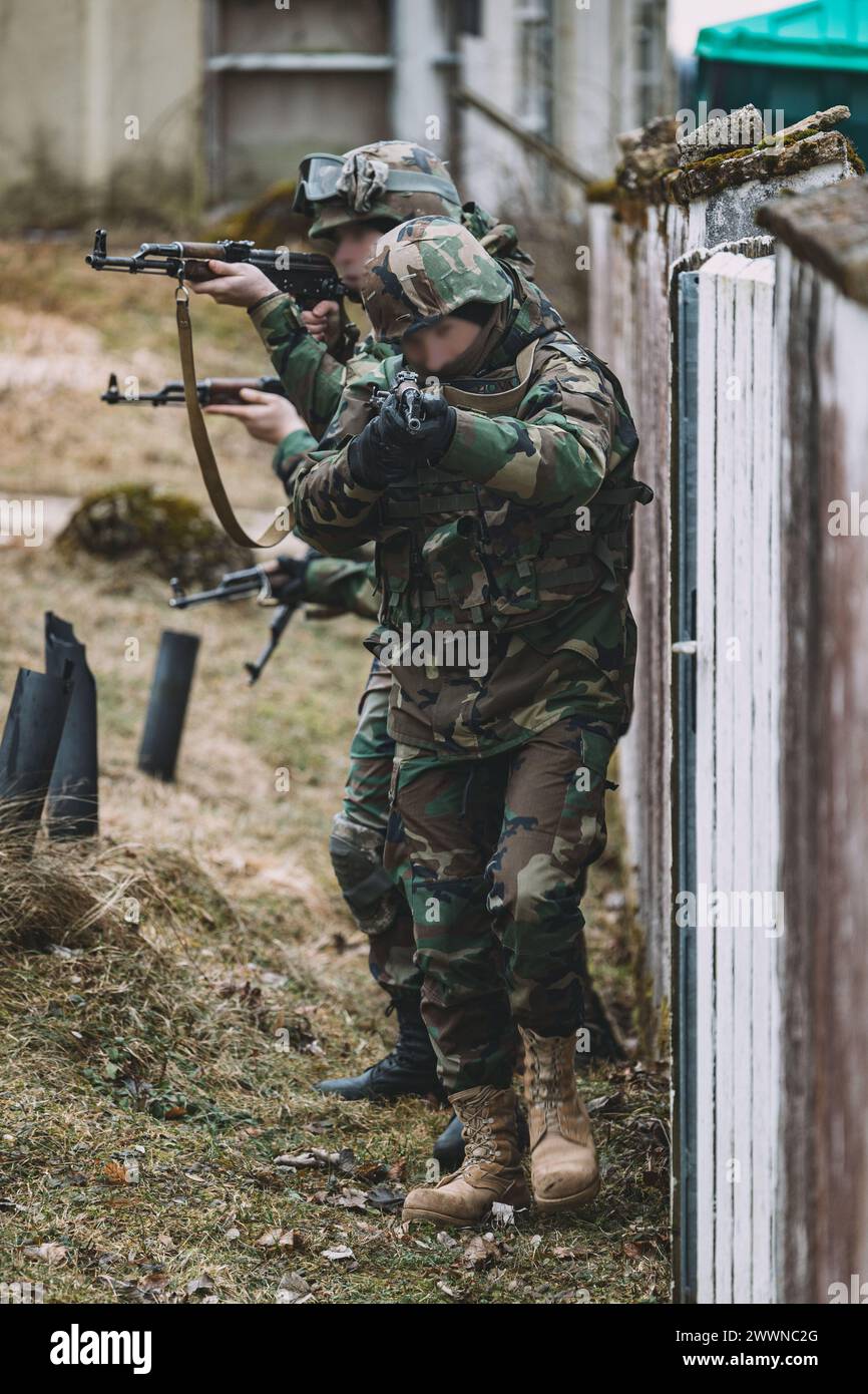 Moldovan soldiers move as a squad before entering a room during an ...