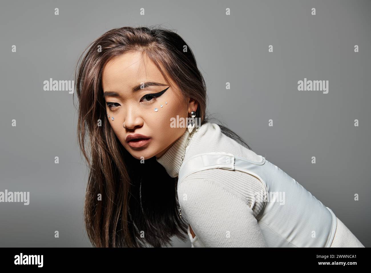 Pretty Asian Woman In Her 20s With Heavy Makeup Sideways Leaning