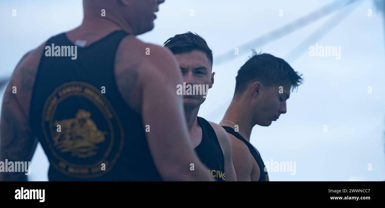 U.S. Marine Corps Instructors of Water Survival (MCIWS) stand and ...