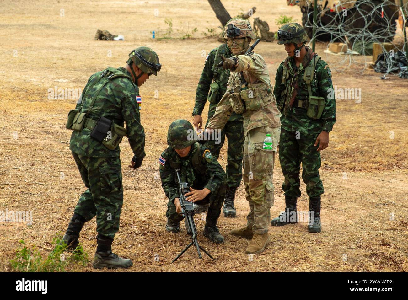Soldiers of the Royal Thai Army prepare to enter the firing range for ...