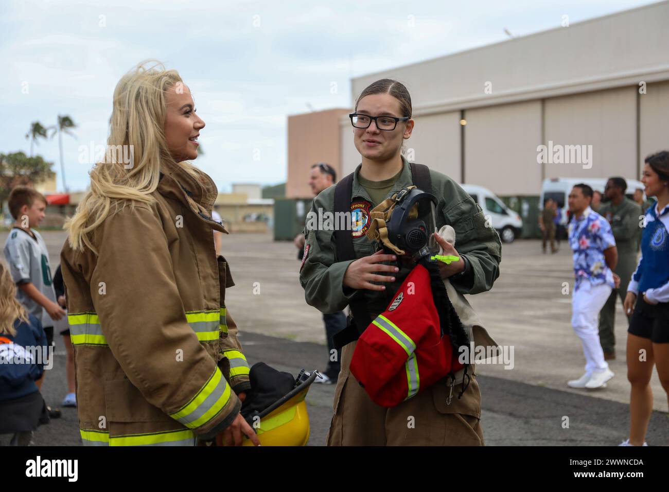 NFL cheerleader Whitney Schutt, left, talks to U.S. Marine Corps Cpl ...