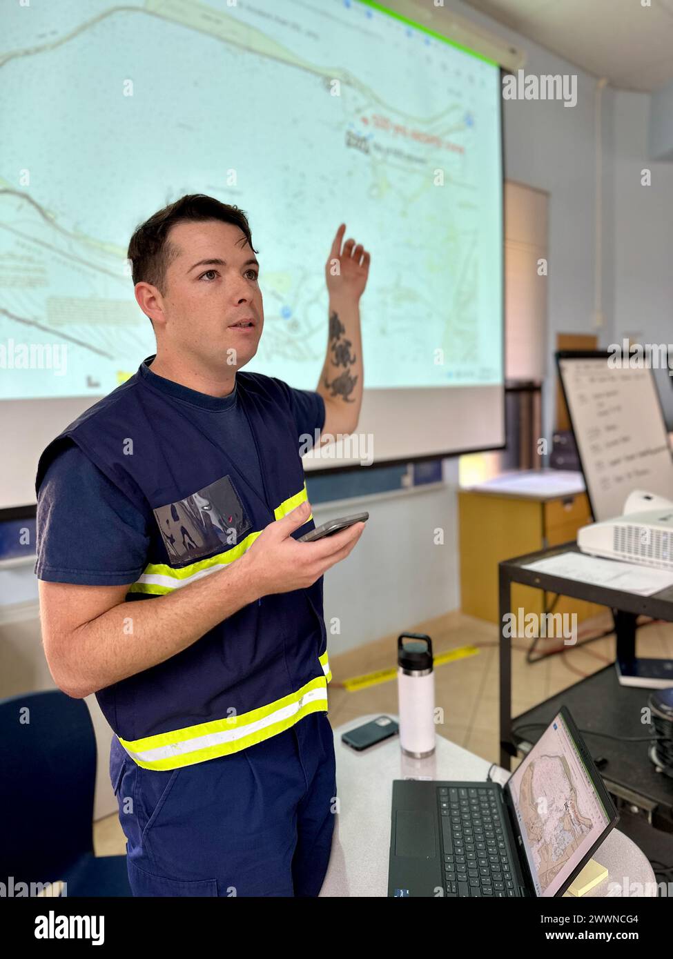 Petty Officer 3rd Class Austin Norton briefs during a three-day ...