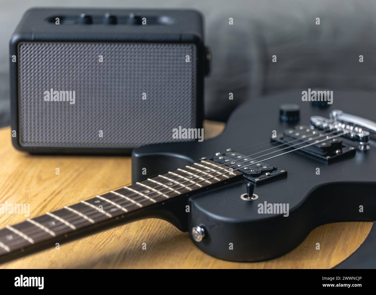 Black electric guitar and speaker close-up. Guitar amplifier, musical ...