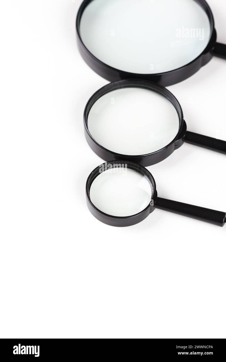 Three magnifiers over white Stock Photo - Alamy