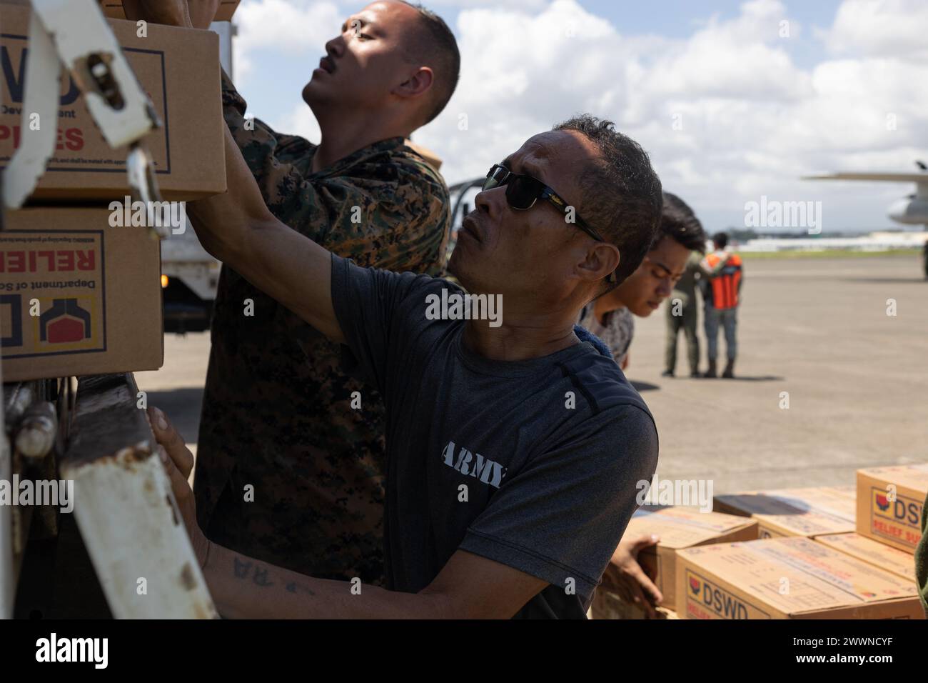 U.S. Marine Corps Cpl. Raphael Viray, left, an aviation supply ...