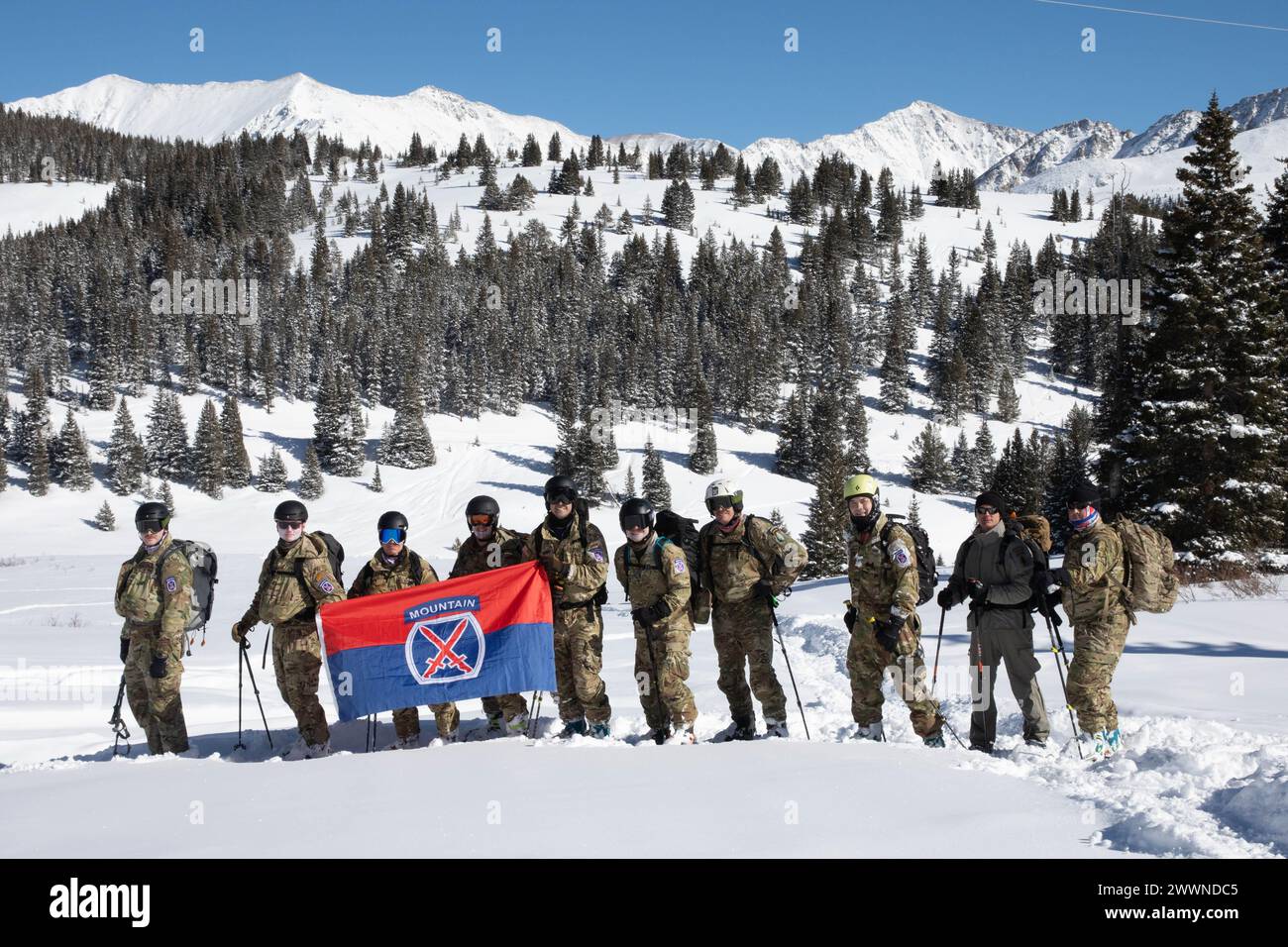Soldiers with the 10th Mountain Division pose for a photo while holding ...