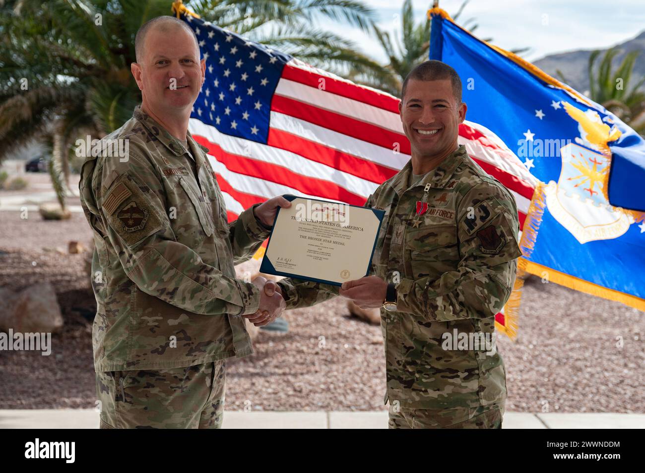 U.S. Air Force Col. Joshua DeMotts, left, 99th Air Base Wing commander ...