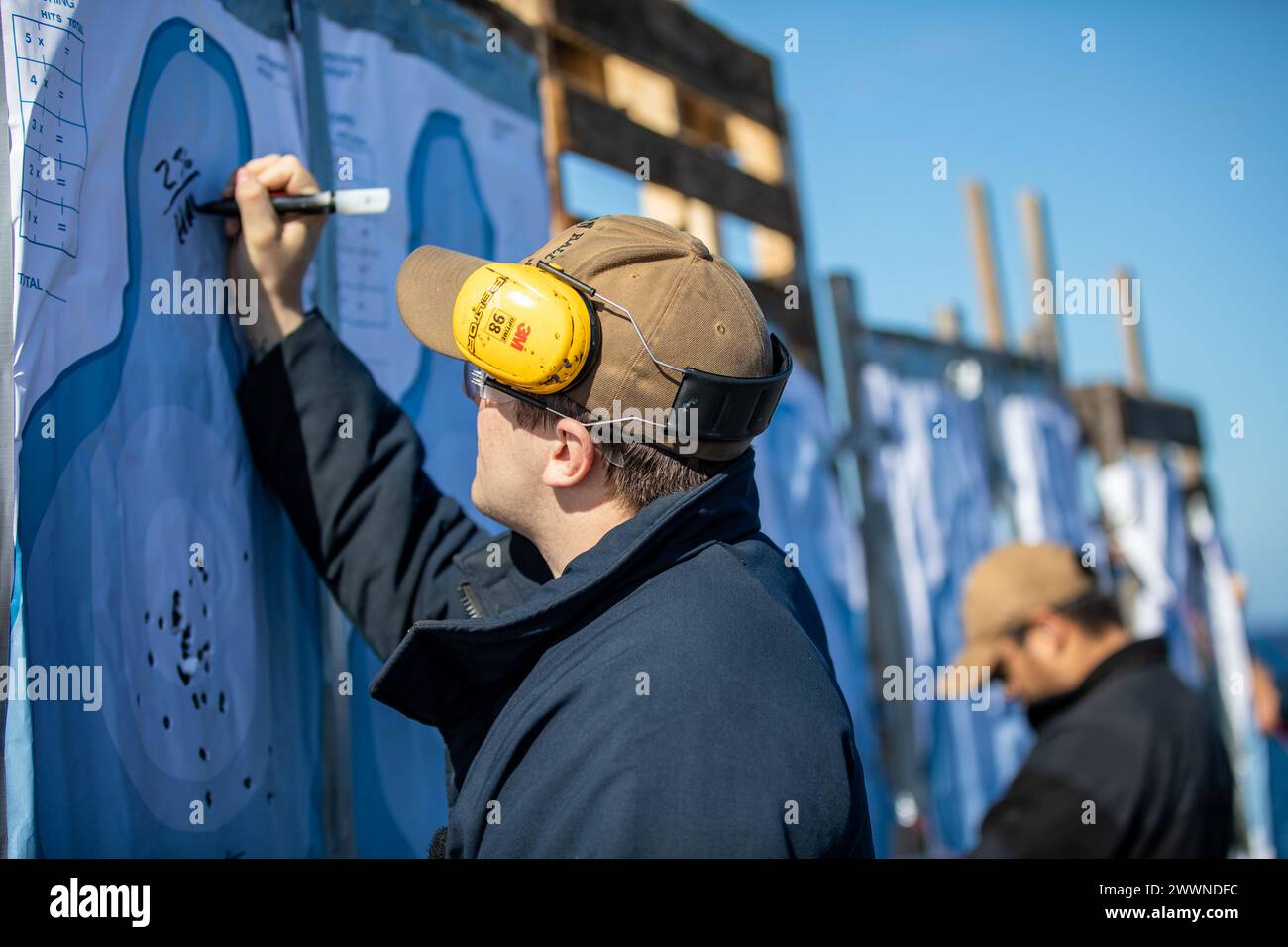 Electronics Technician 2nd Class Chance Malcomesius tallies the score ...