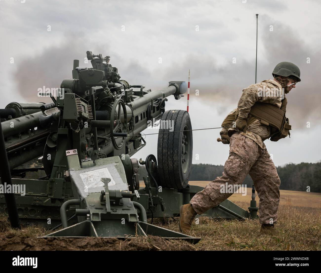 U.S. Marines with The Basic School demonstrate how to operate an M777 ...