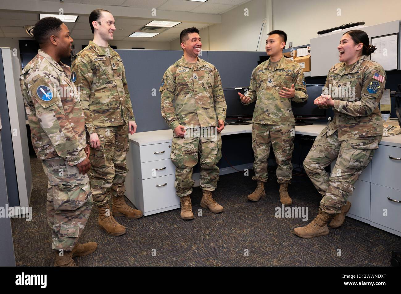 Service members chat in an office on Cheyenne Mountain Space Force ...