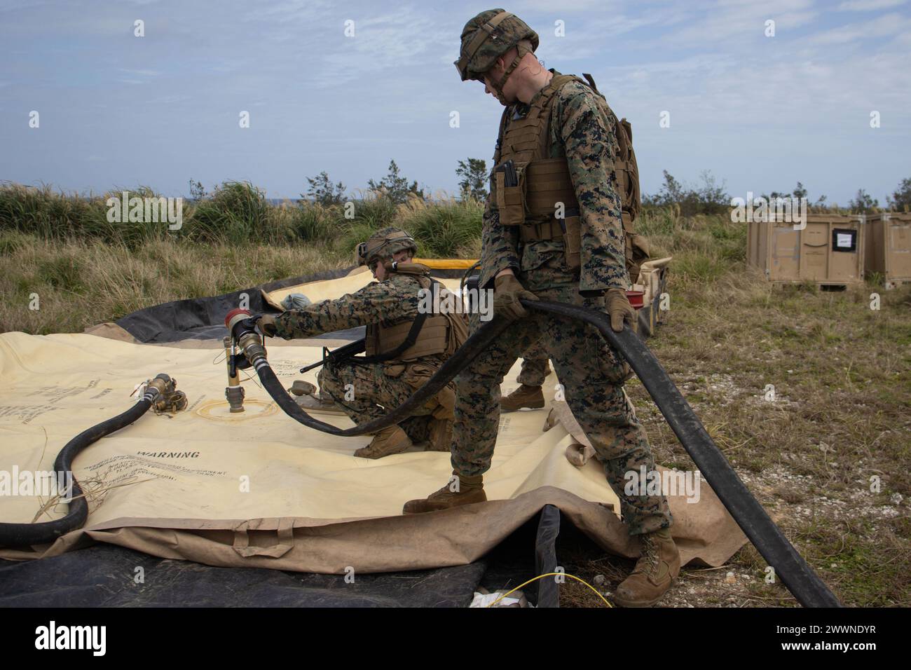 U.S. Marine Corps Lance Cpl. Noah Gehring, left and U.S. Marine Corps ...