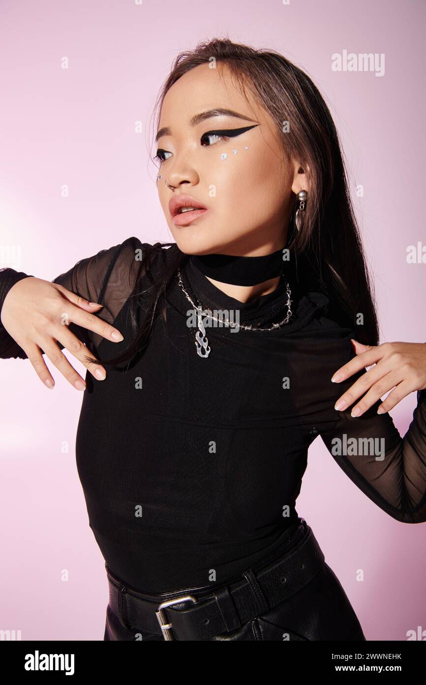 attractive asian young woman with brown hair and daring makeup in black ...