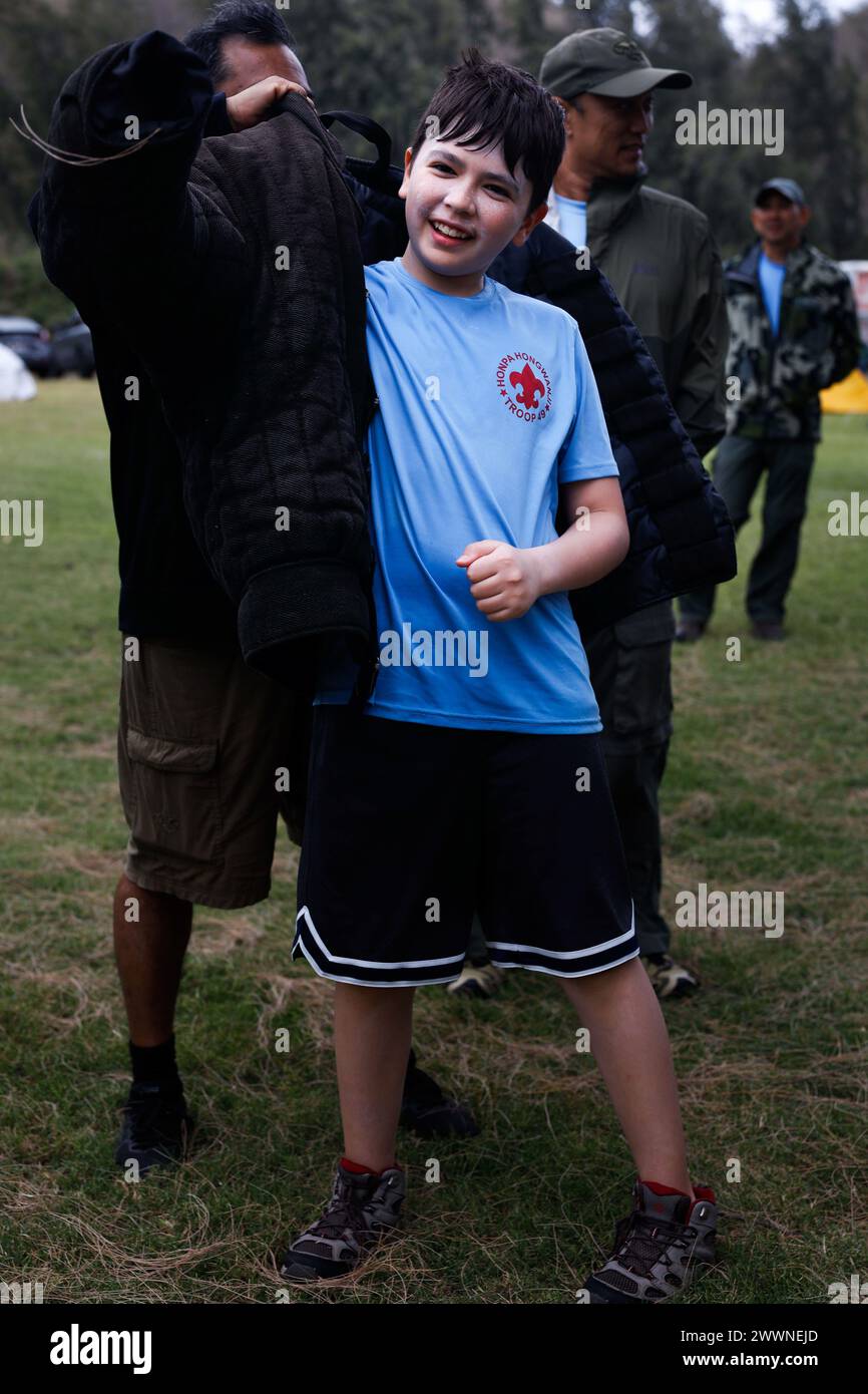 A Scout with Boy Scouts of America, Troop 49, tries on a bite suit ...