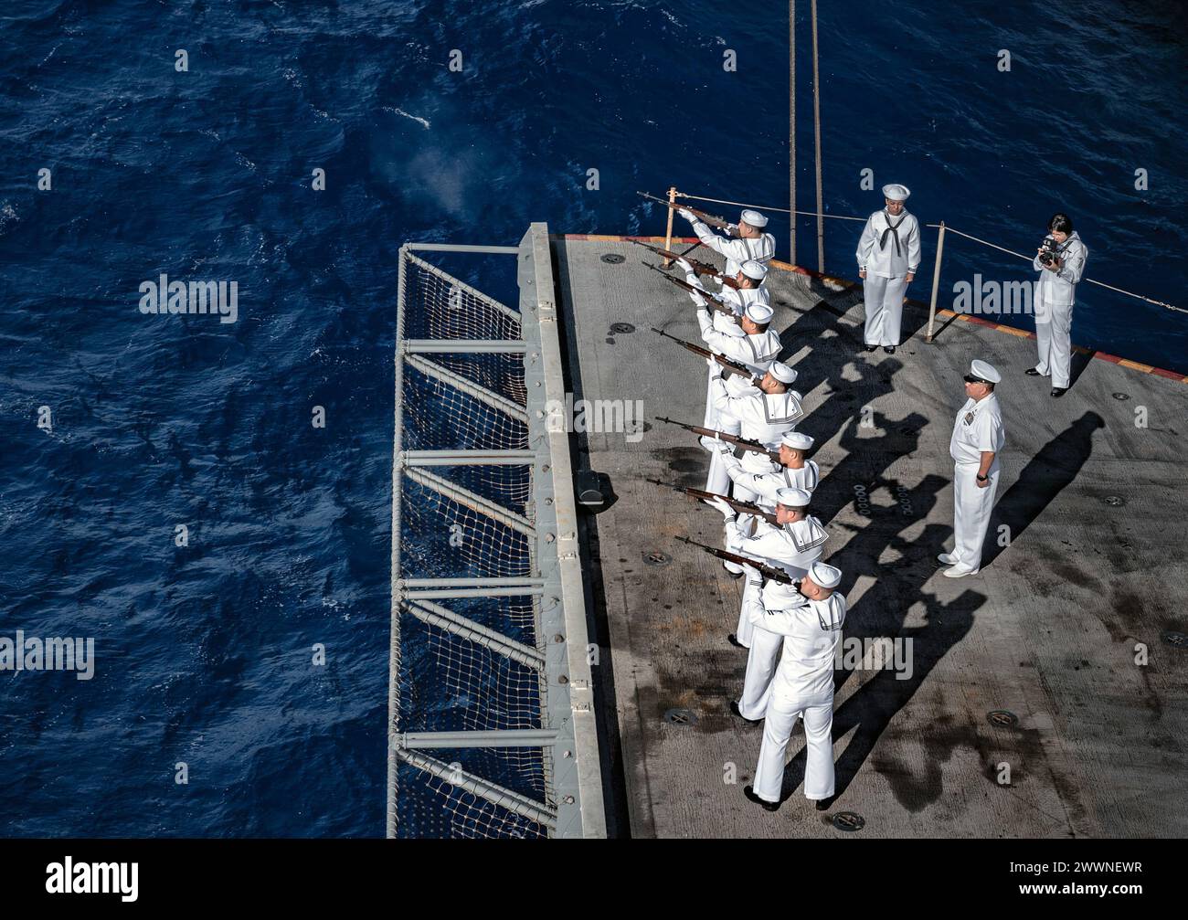 PHILIPPINE SEA (Feb. 19, 2024) U.S. Sailors fire a 21-gun salute during ...