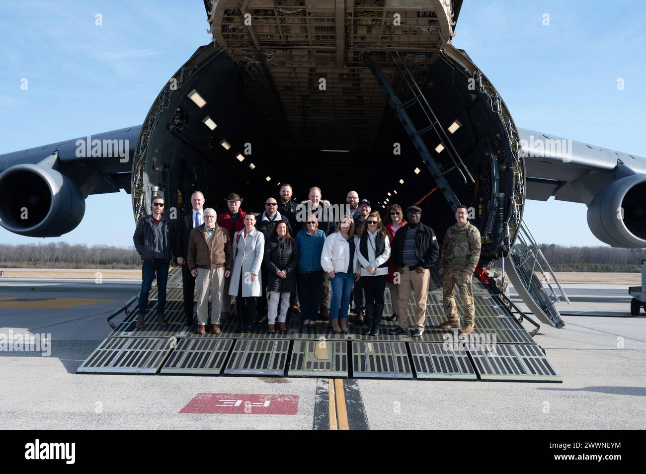 Team Dover honorary commanders pose for a photo on the forward ramp of ...